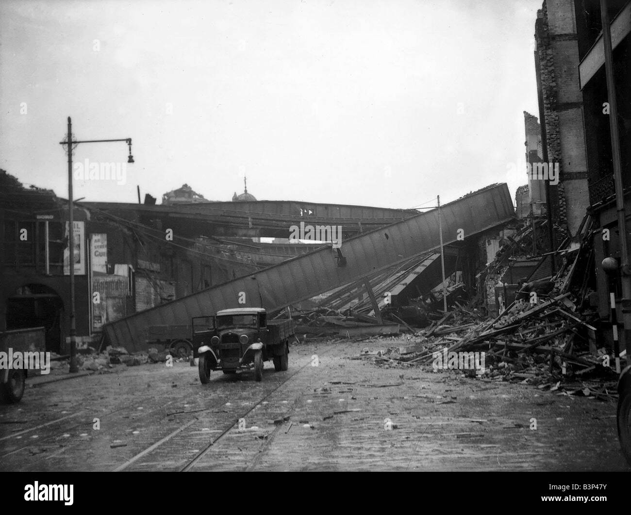 London Air Raid Bomb Damage WW2 An abandoned truck near the remains of ...