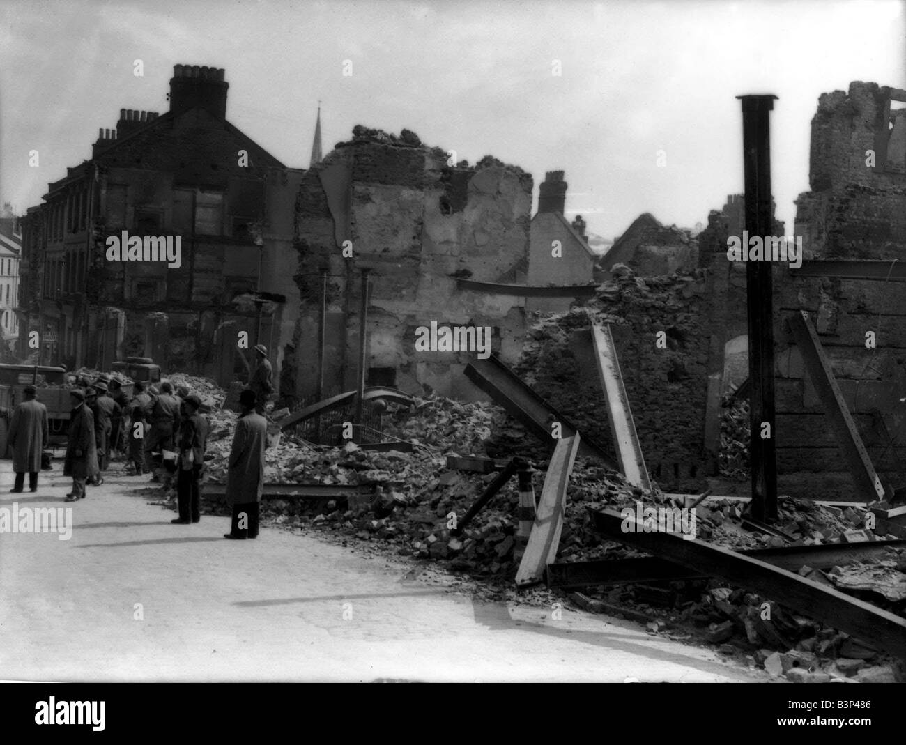 Plymouth Bomb Damage WW2 Civilians and rescue workers search through ...