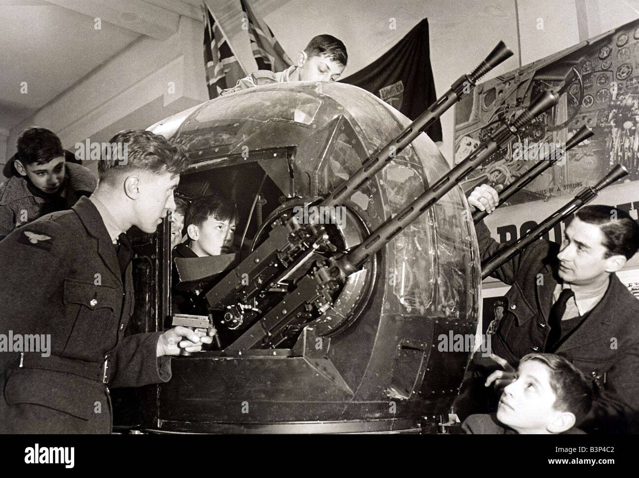 A RAF cadet explains the workings of the rear turret of a Halifax ...