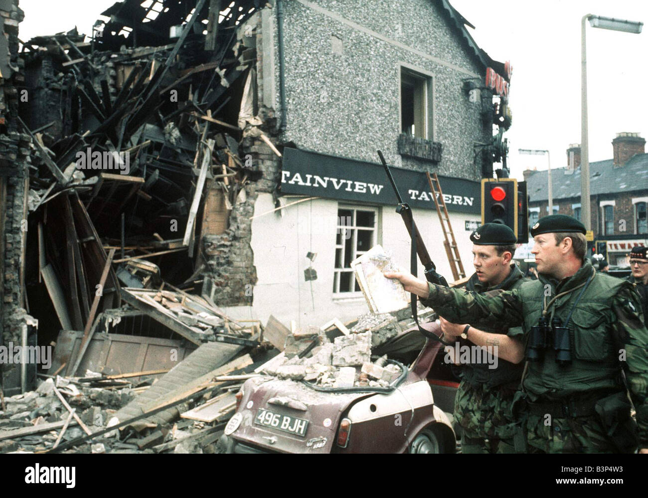 IRA bomb blast wrecks the Mountainview Tavern in Belfast Soldiers view ...