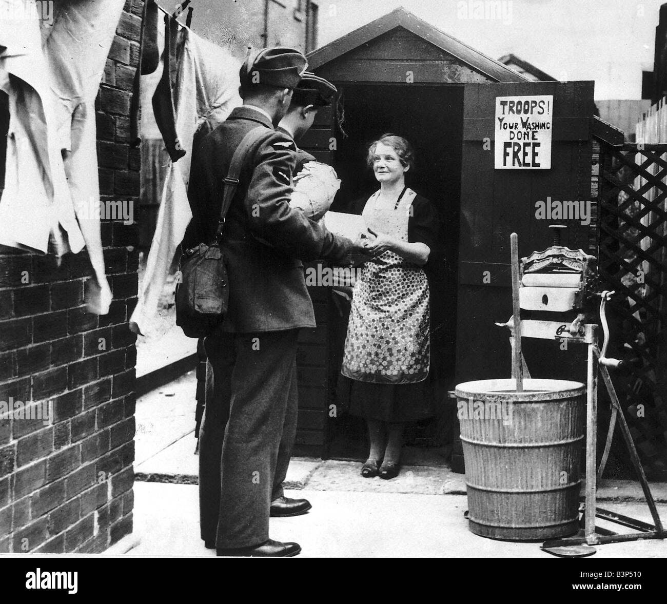 Free washing for the troops a laundry woman hands over the soldiers ...
