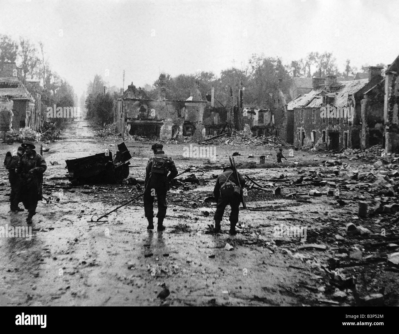 WW2 Royal Engineers clearing mines from the main street in Tilly Sur ...