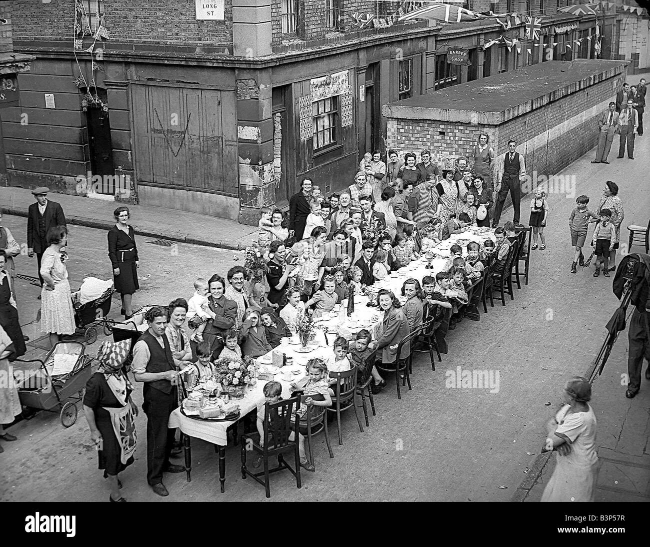 Families have fun at a street party to celebrate VE day to mark the end ...