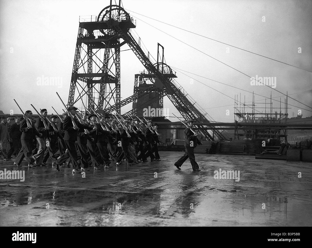 Member of the Home Guard marching at a coal mine during WW2 Stock Photo ...