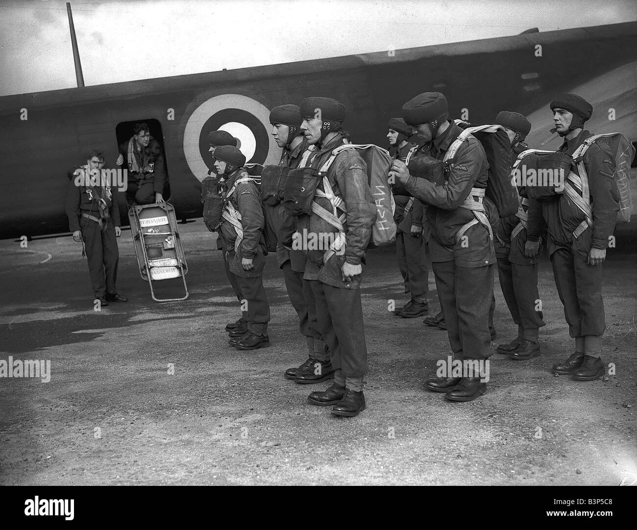Parachutists during WW2 kitted up for exercise and ready to board plane ...
