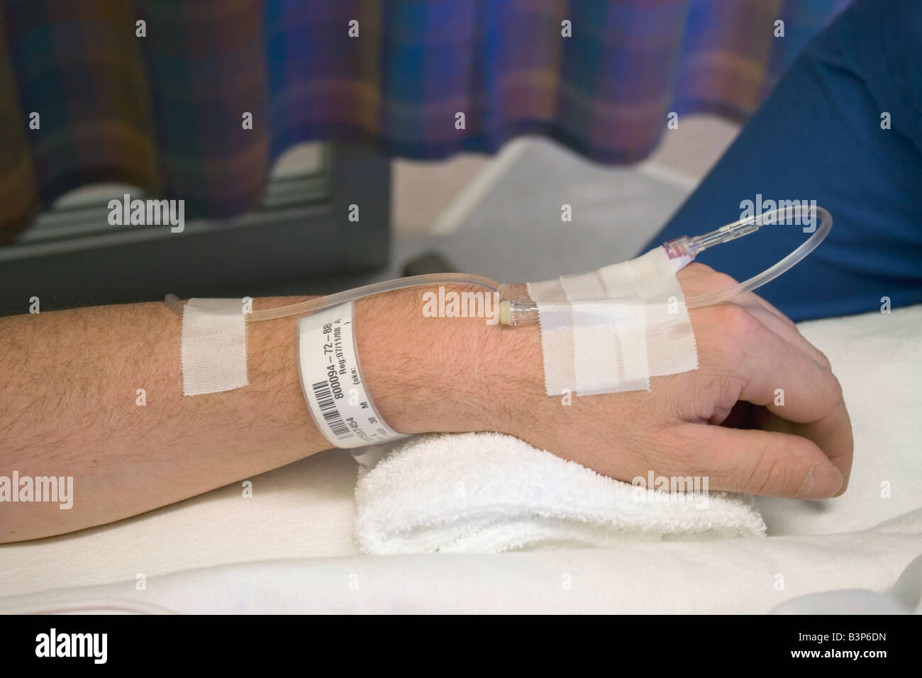 IV placed in a male patient's hand Stock Photo - Alamy