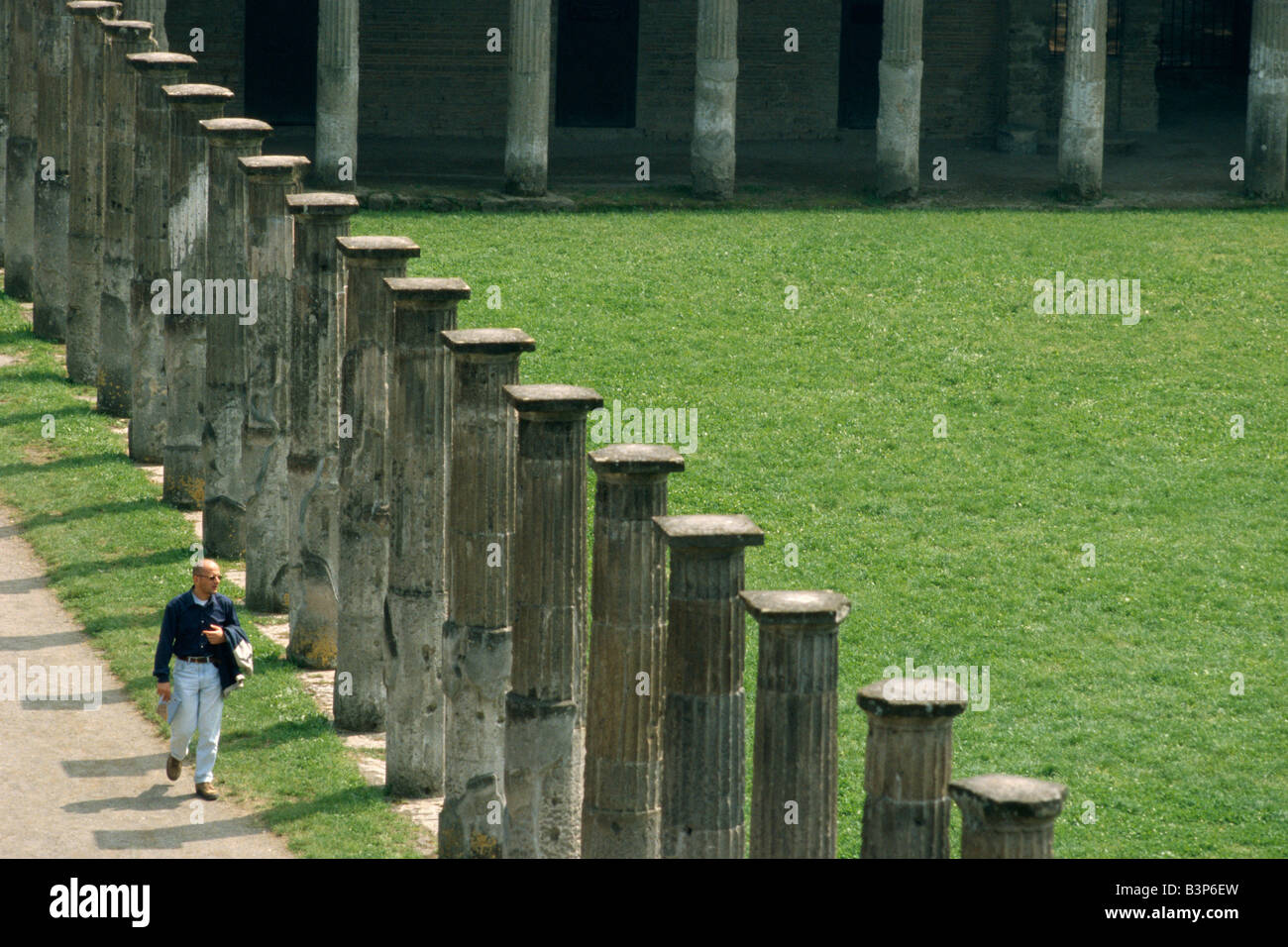 Pompei Italy A tourist walks in the Gladiators Barracks Caserma dei ...