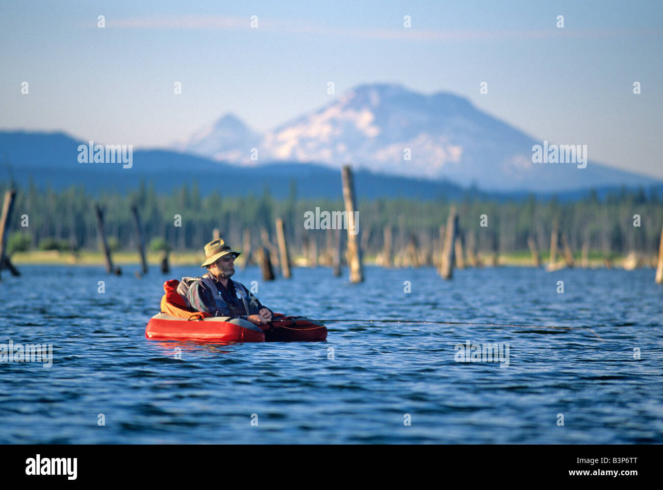 Fly fisherman in float tube Crane Prairie Oregon Stock Photo - Alamy