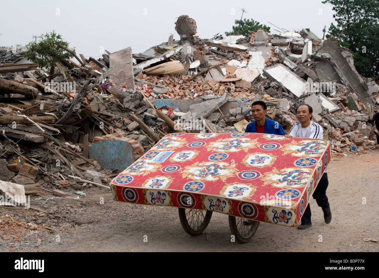 Survivors of the earthquake of May 12 2008 in Sichuan scavenge a ...