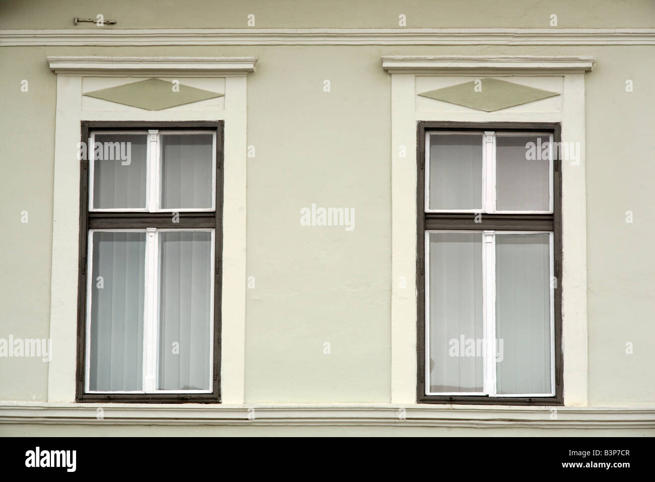 two romanian classic windows on painted wall Stock Photo - Alamy