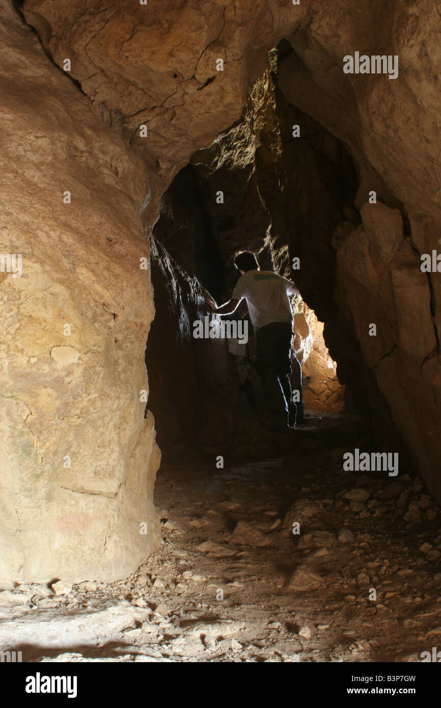 Israel Carmel Mountains National Park Wadi Kelah Male hiker inspecting ...