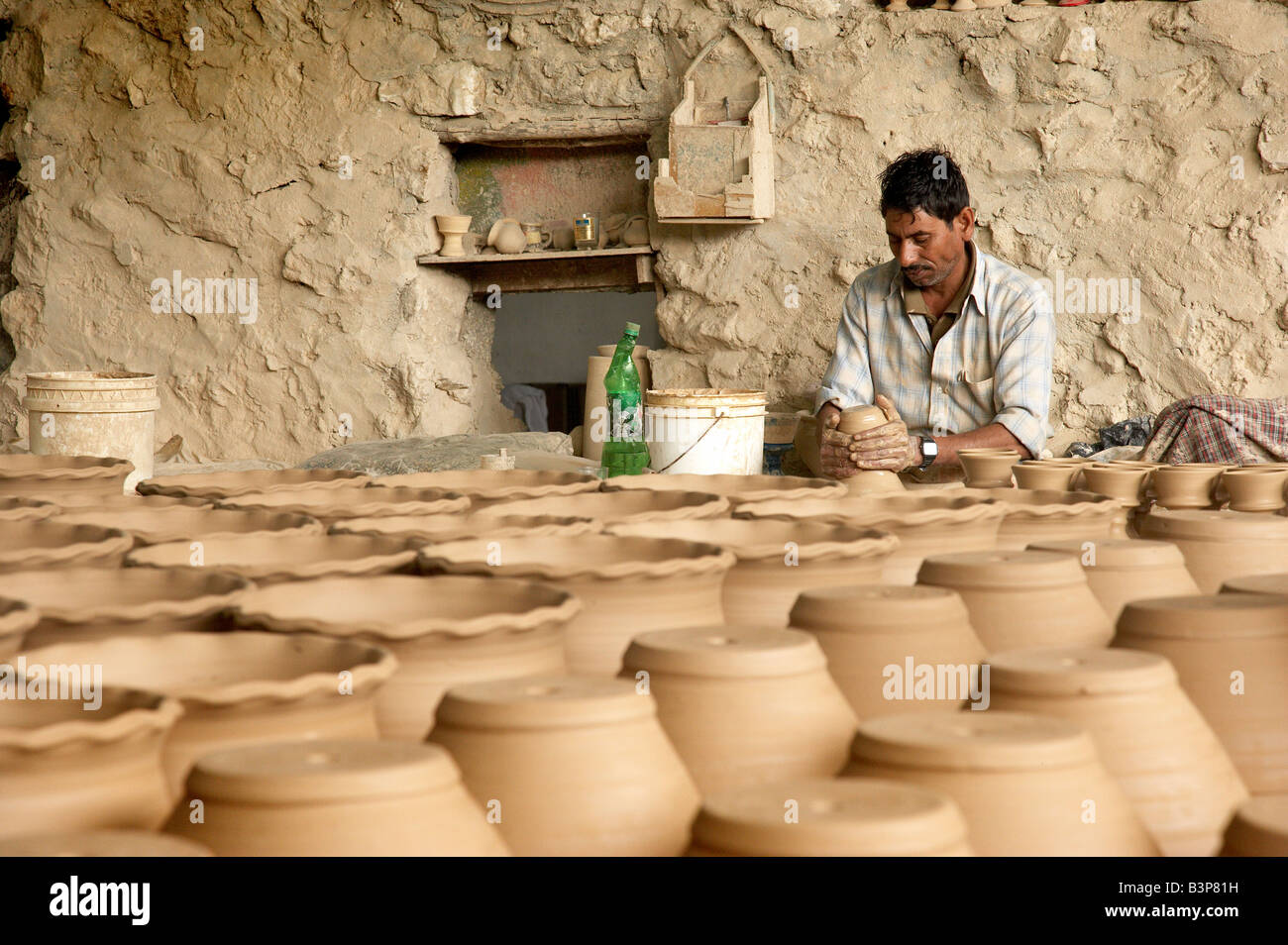 A potter working at his wheel at a pottery in Bahrain Stock Photo - Alamy