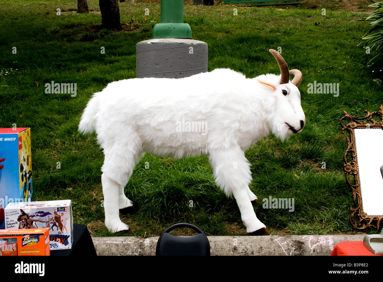 Artificial goat standing on a wall Stock Photo - Alamy