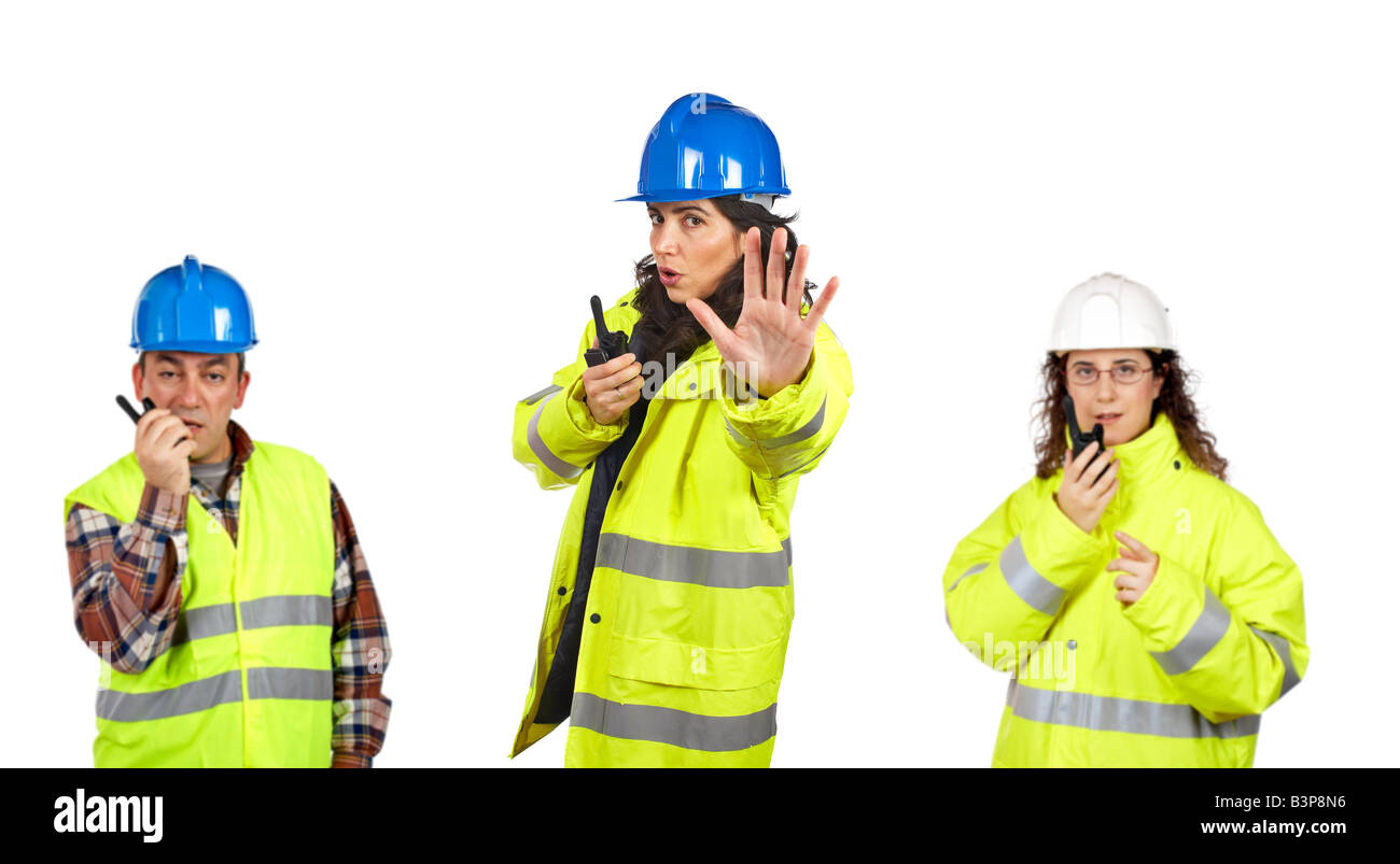 Three construction workers talking with a walkie talkie over a white ...