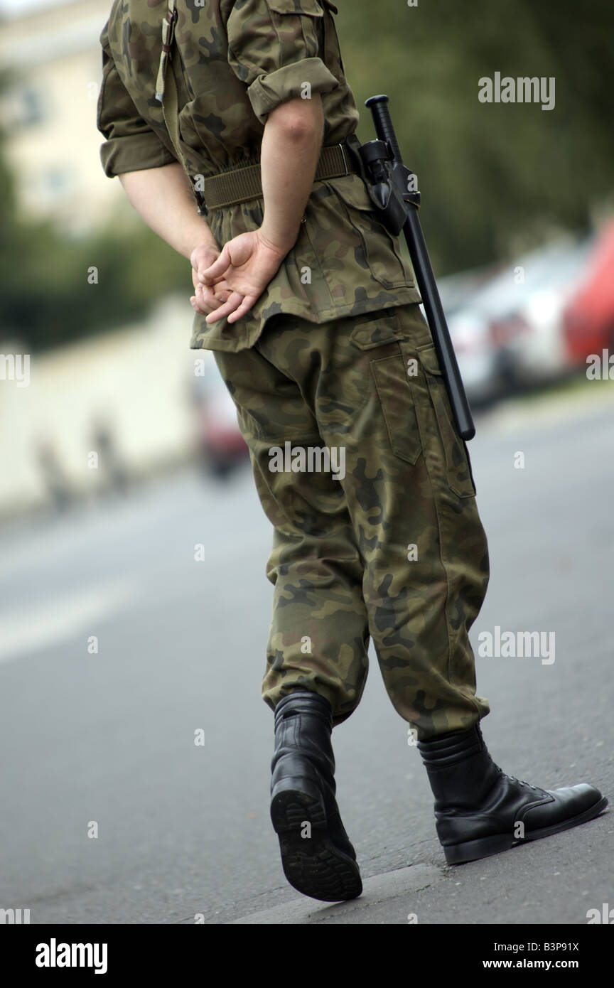 Soldier walking on the street Stock Photo - Alamy