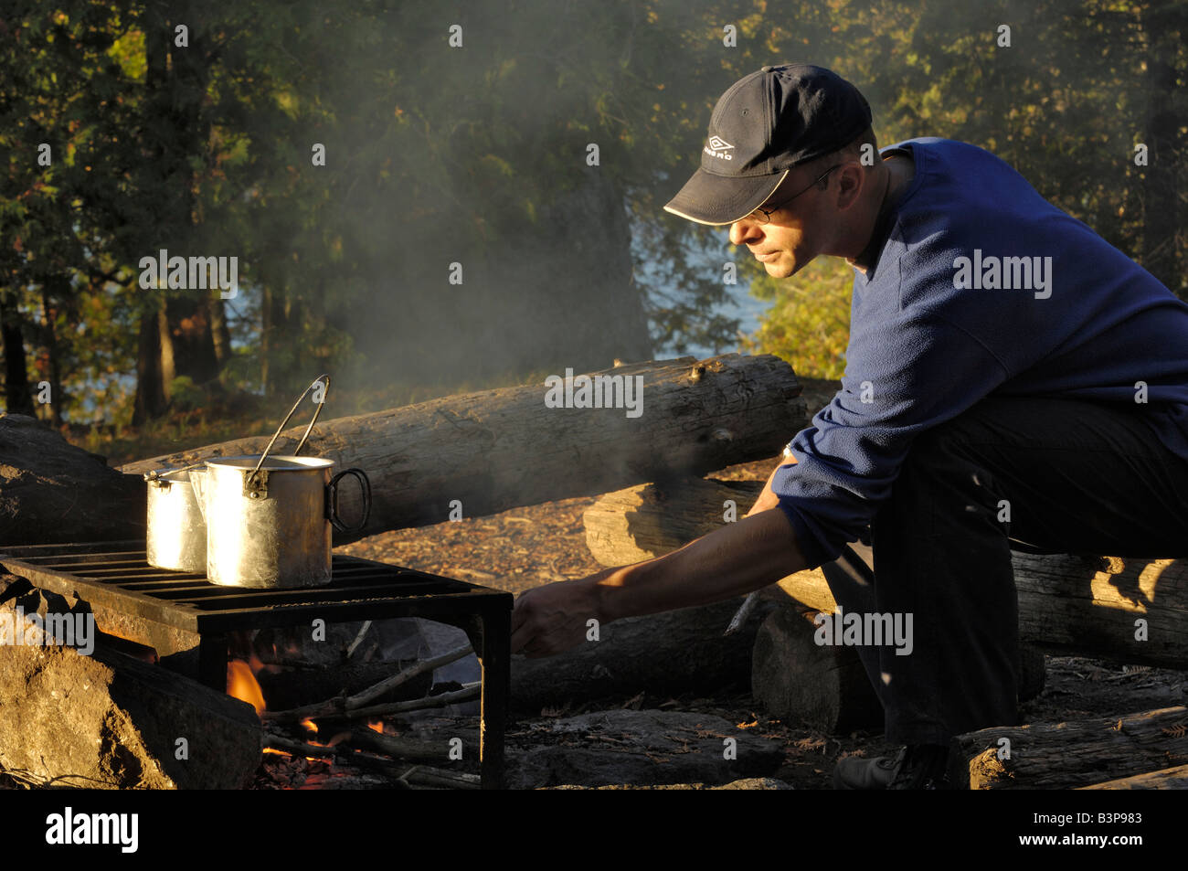 Cooking on a campfire, Minnesota, USA Stock Photo - Alamy