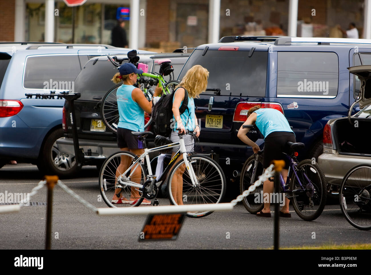 Women getting ready for a bicycle ride Stock Photo - Alamy
