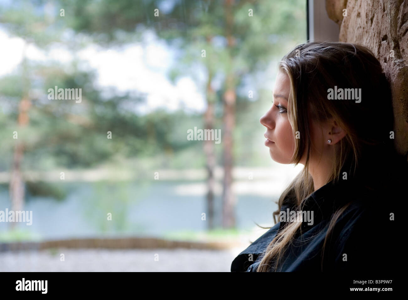 Silhouette of the girl in window Stock Photo - Alamy