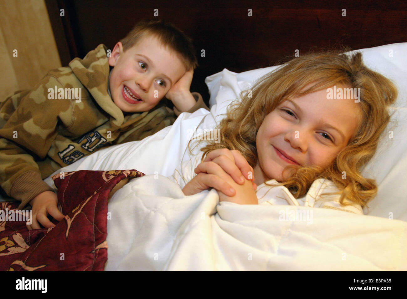cousins playing around at bedtime Stock Photo - Alamy
