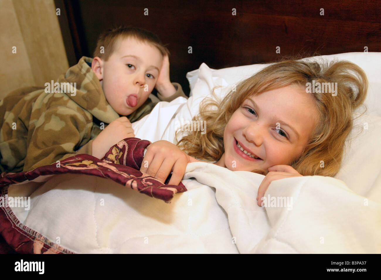 cousins playing around at bedtime Stock Photo - Alamy