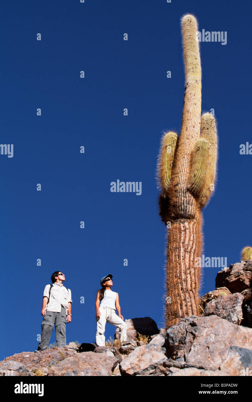 Chile, Atacama Desert, San Pedro de Atacama. Tourists hiking in the ...