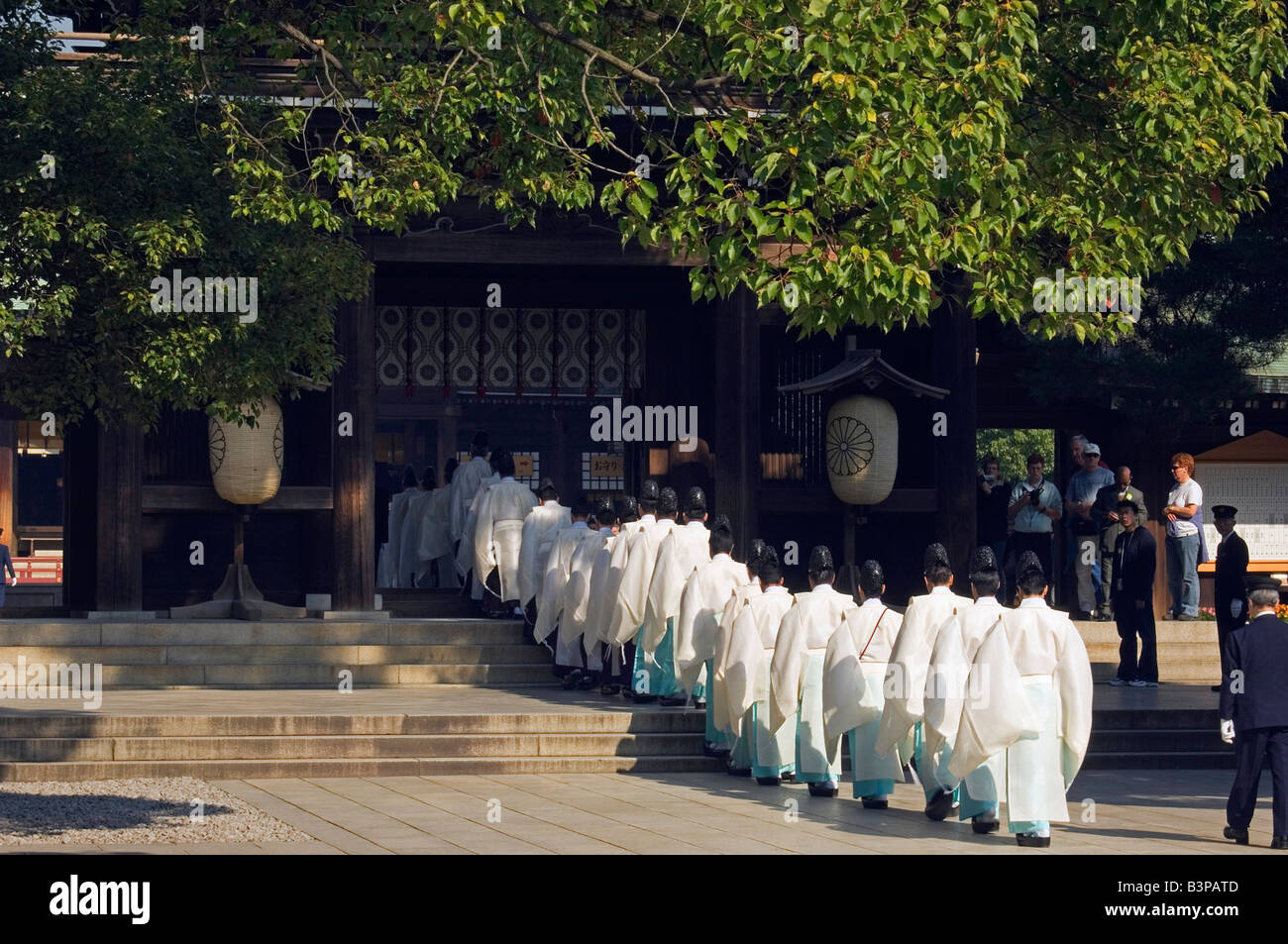 Japan, Tokyo, Harajuku. Meiji Jingu Shrine procession of temple priests ...