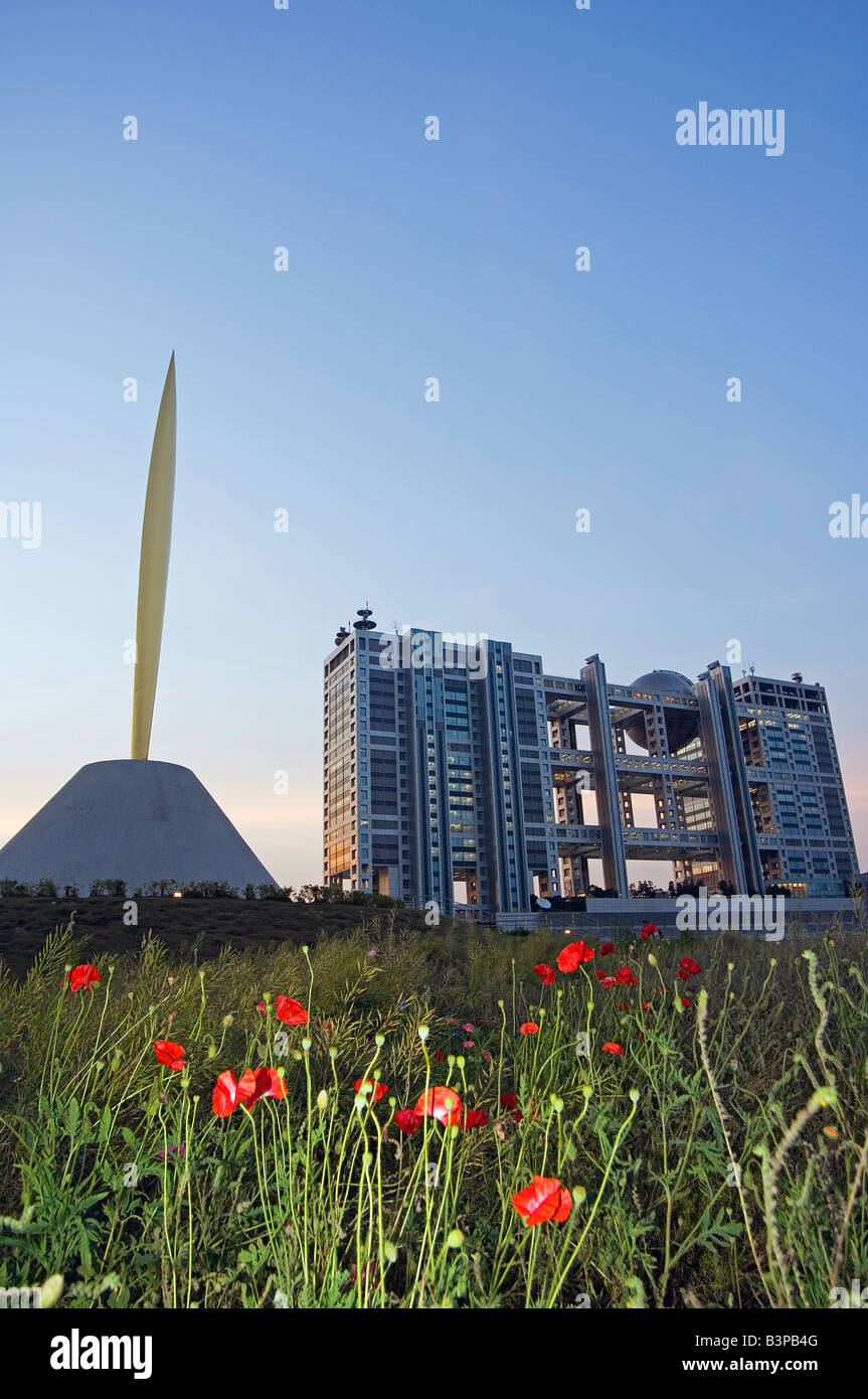 Japan, Tokyo, Odaiba District. The Flame of the Liberty Gold Needle and ...