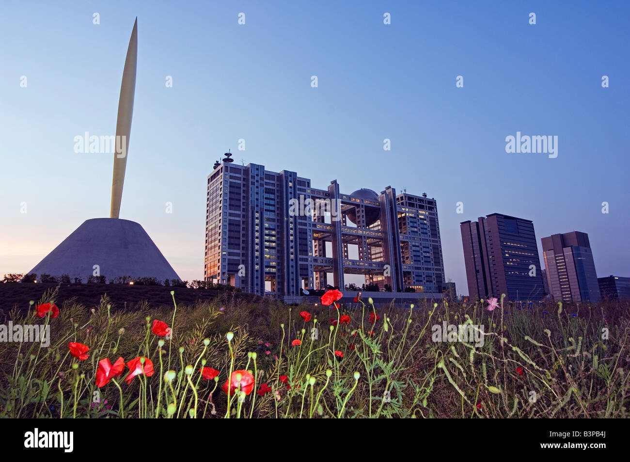 Japan, Tokyo, Odaiba District. The Flame of the Liberty Gold Needle and ...