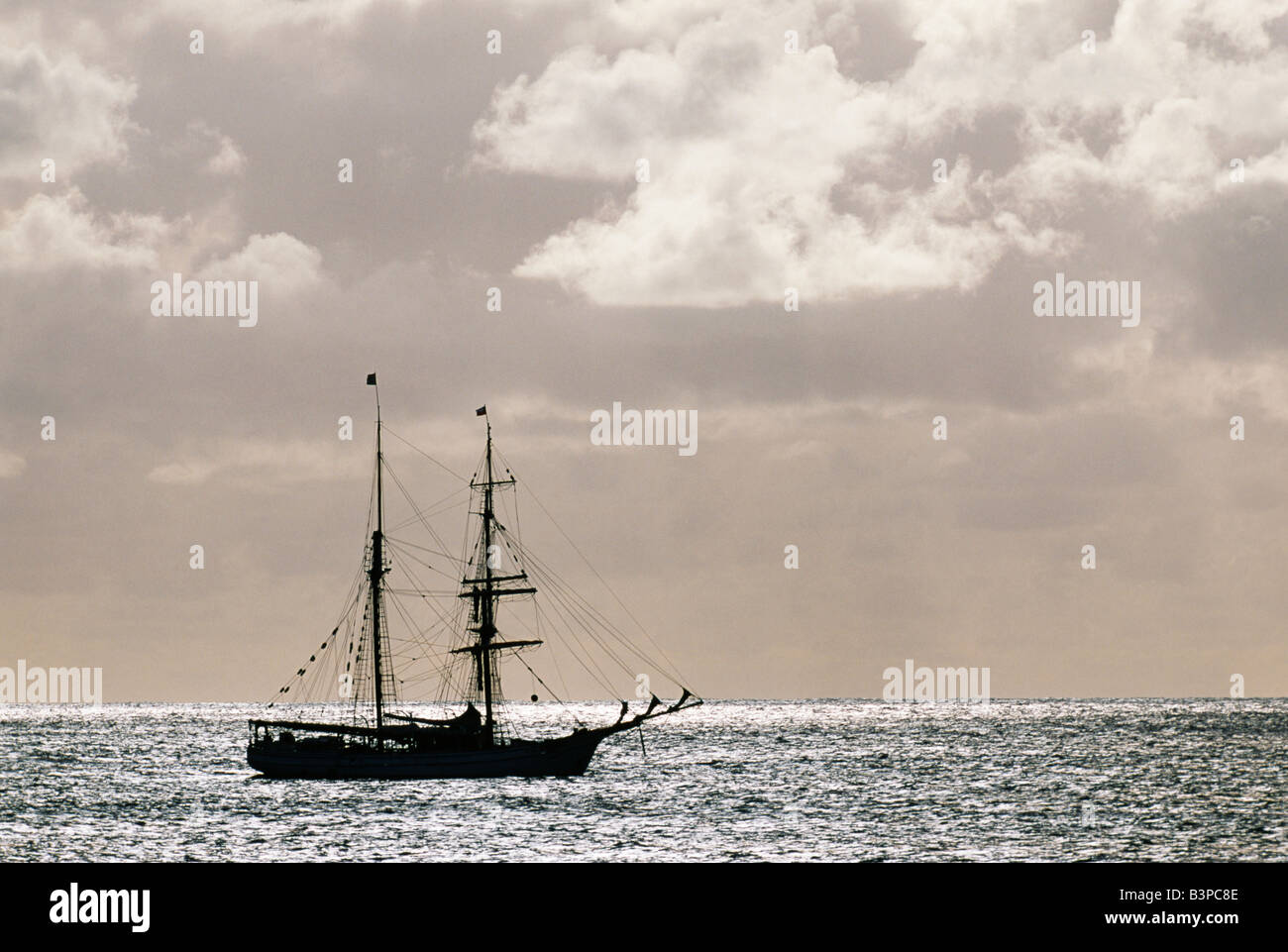 Chile, Easter Island, Hanga Roa. A sailing ship anchored in front of ...