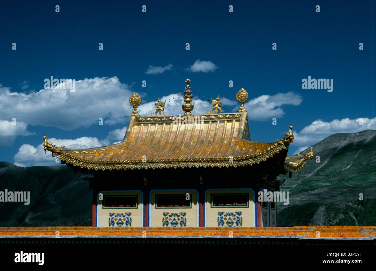 China, Gansu Province, Xiahe. The upturned eaves are decorated with ...