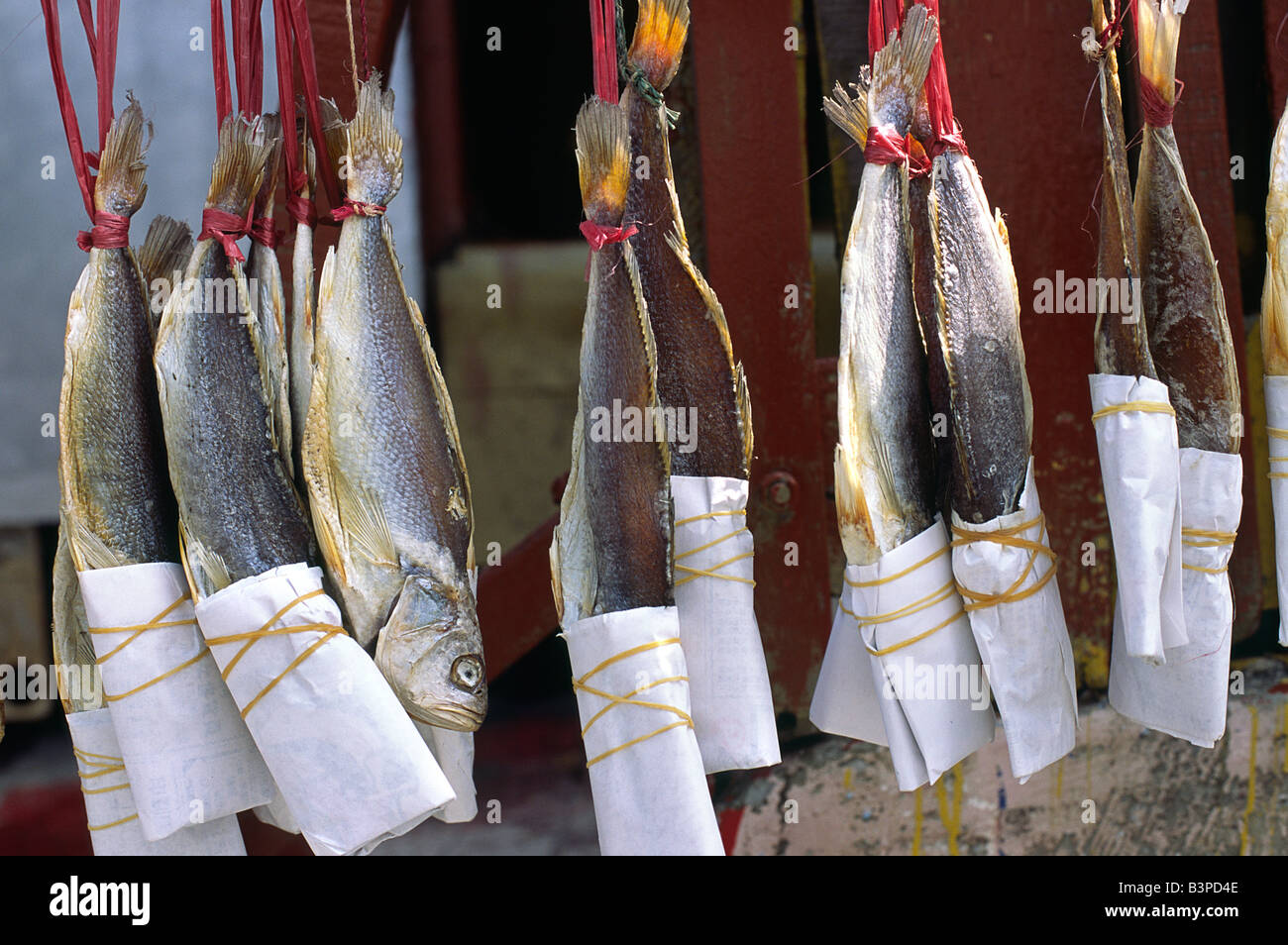 China, Hong Kong, Lantau Island. Salt fish hangs in the streets of Tai ...