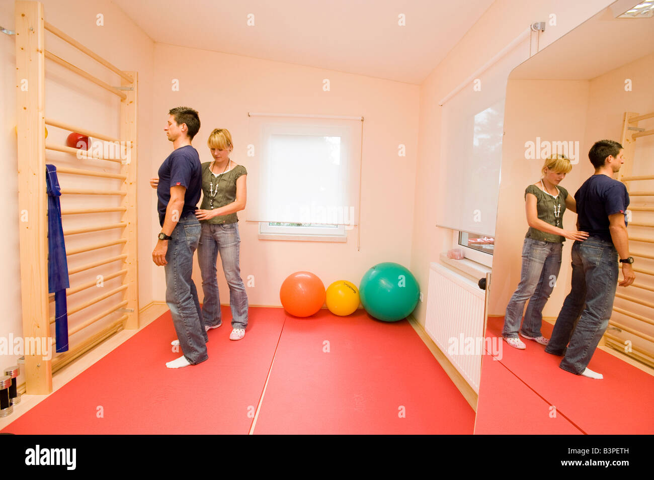 Physiotherapist, teacher of the Alexander technique guiding a patient ...