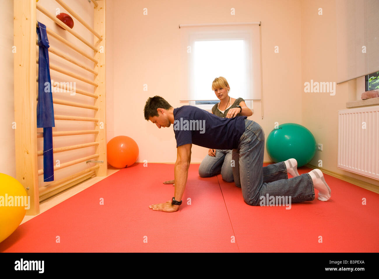 Physiotherapist, teacher of the Alexander technique guiding a patient ...