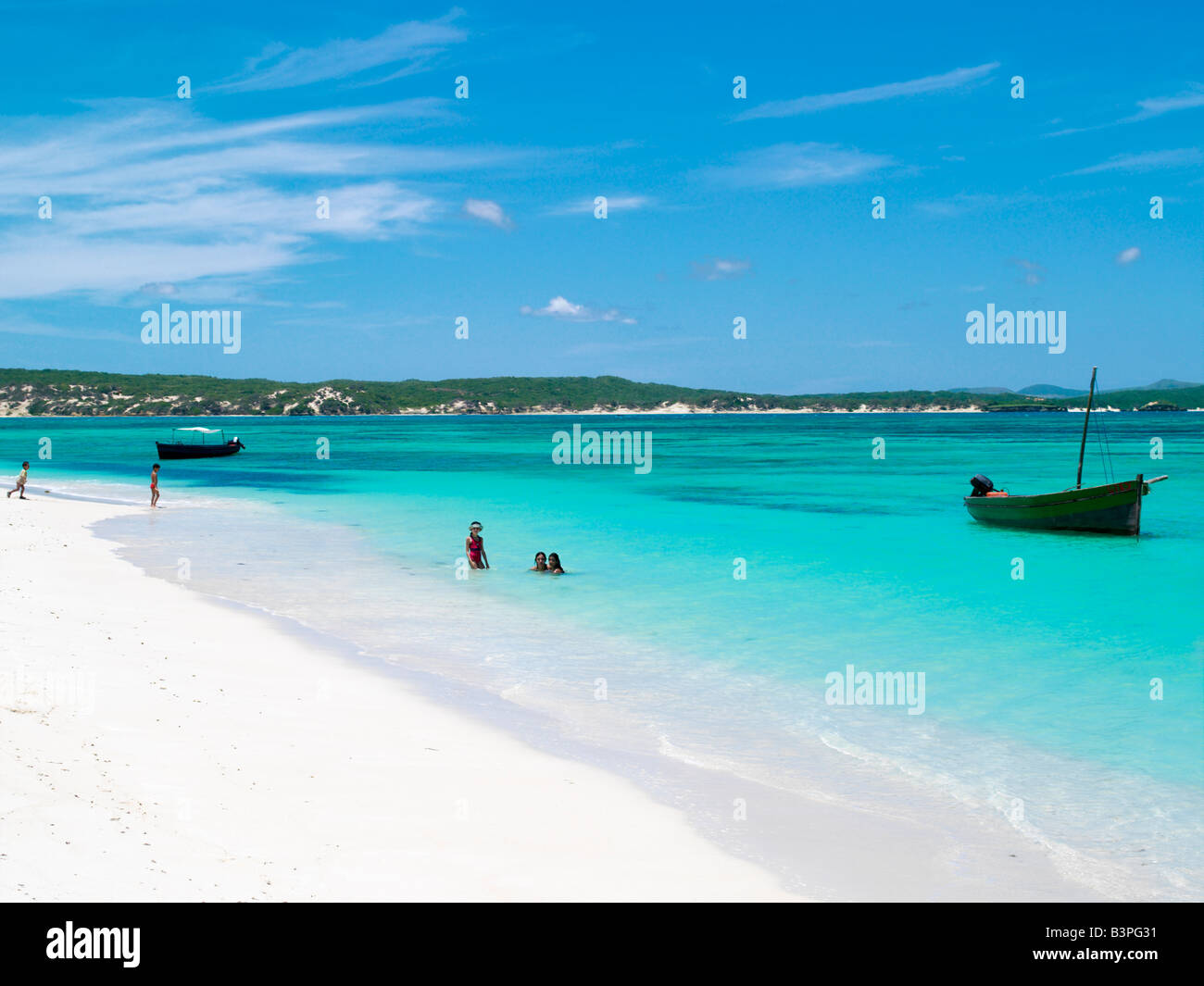Northern Madagascar, Visitors to Suarez Island swim in the crystal ...