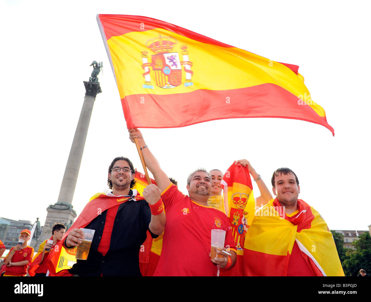 Fans of the Spanish national team with a flag celebrating on ...