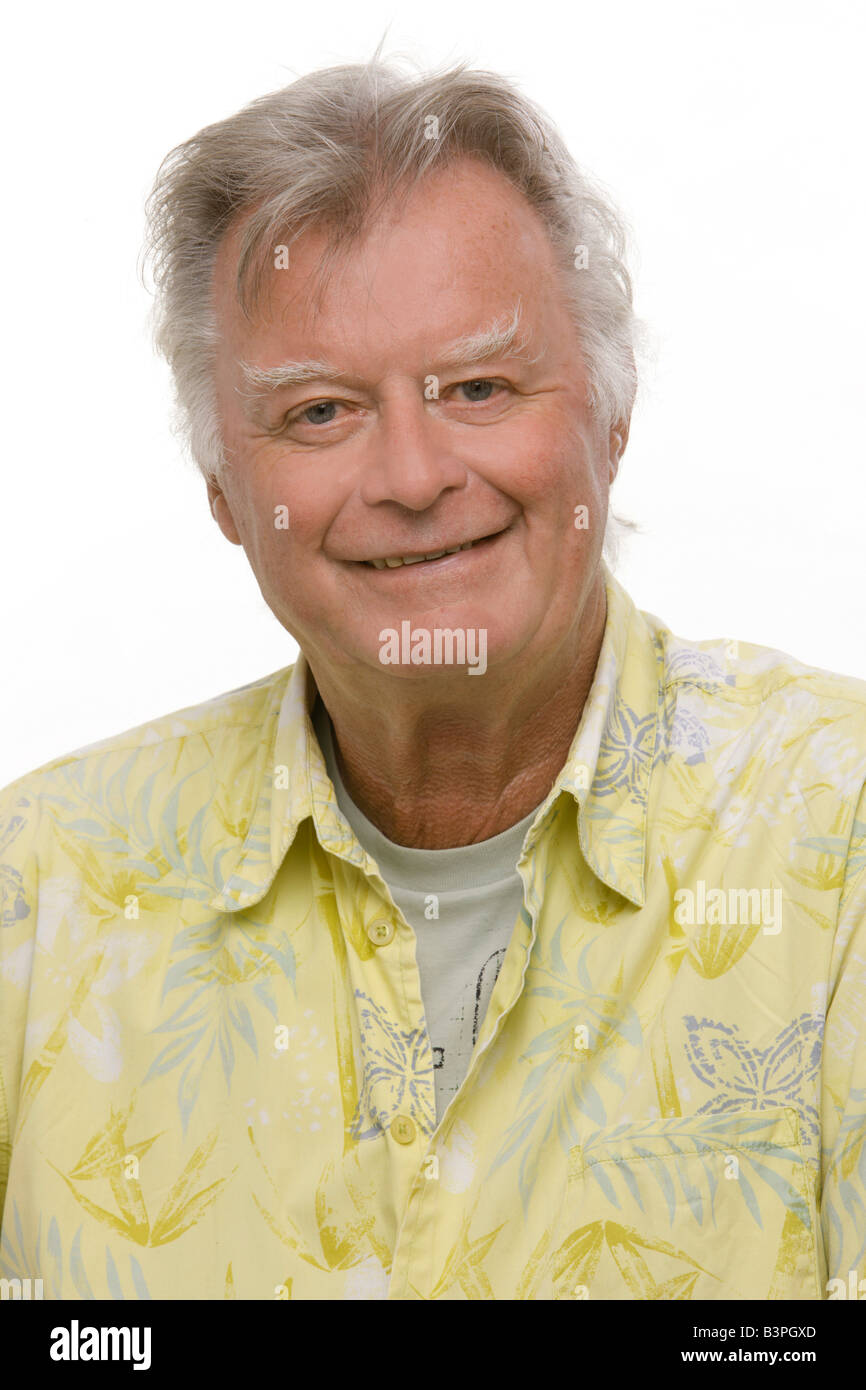 65-year-old smiling man wearing a yellow shirt Stock Photo - Alamy
