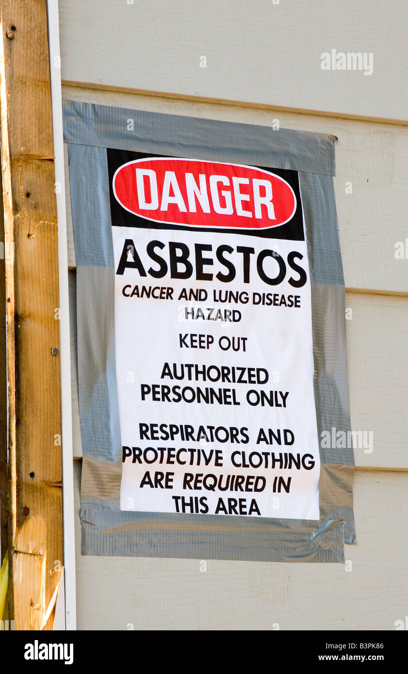 Asbestos danger sign at entrance of work area Stock Photo - Alamy