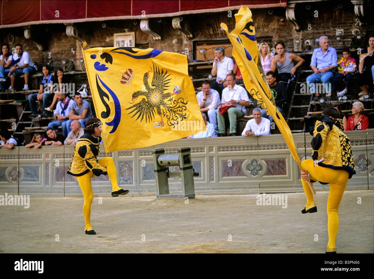 Historic Palio horse race, participants waving banners representing the ...