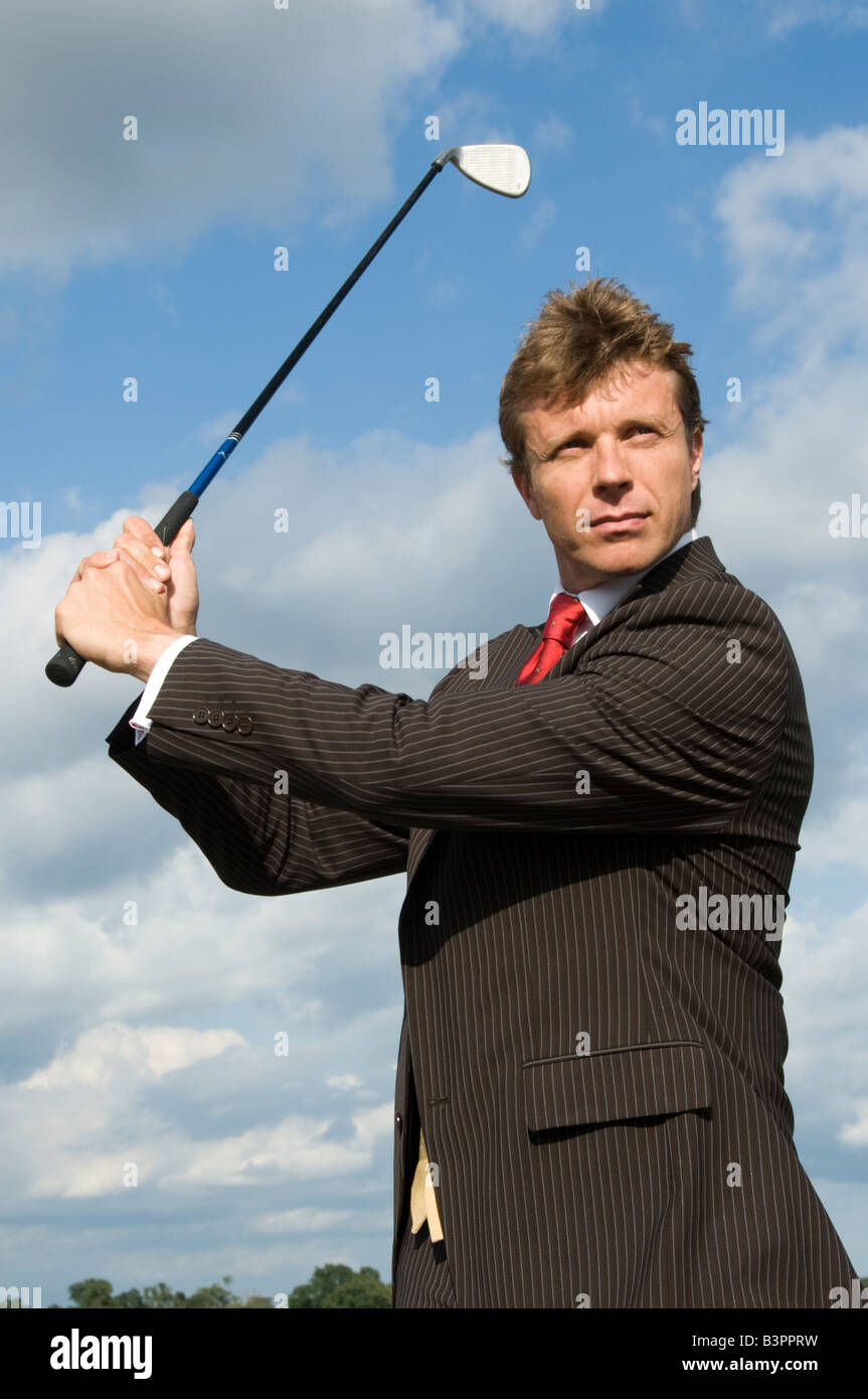 Business man golf club gun hi-res stock photography and images - Alamy