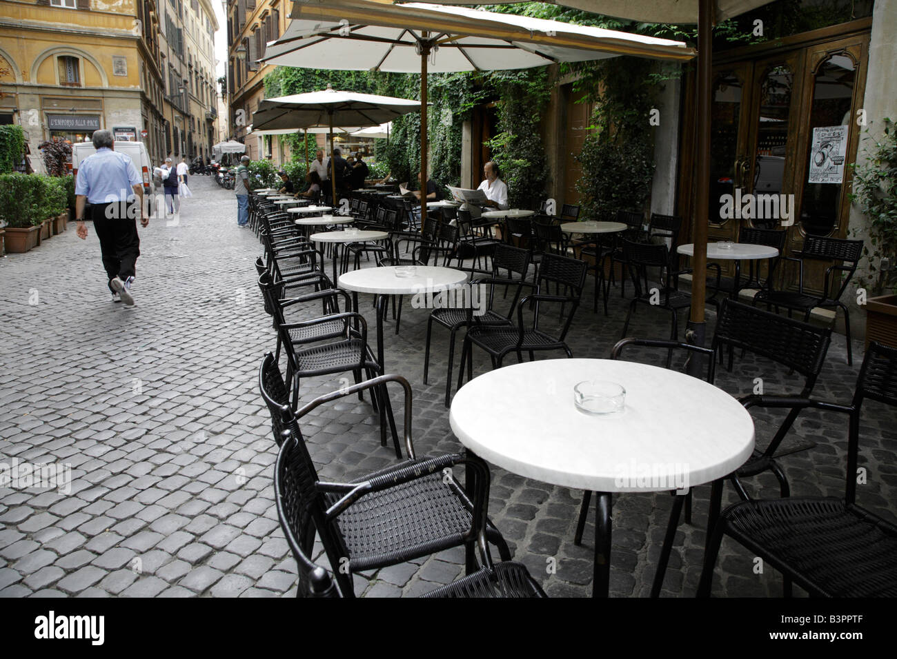Cafe table in street Stock Photo - Alamy