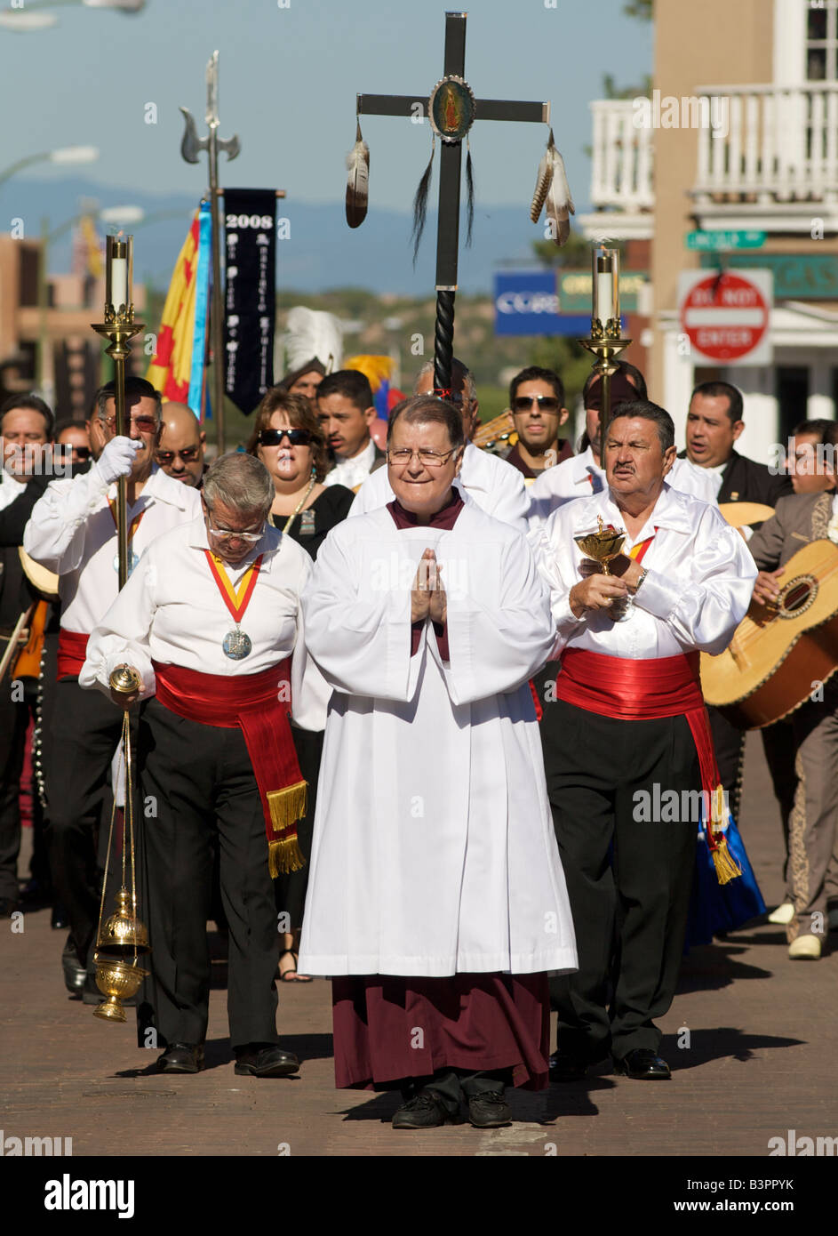 A procession moves along East San Francisco Street in downtown Santa Fe ...