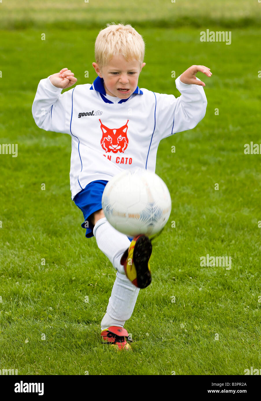 Boy boys kicking a ball hi-res stock photography and images - Alamy
