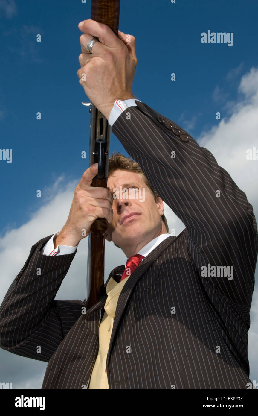 Business man golf club gun hi-res stock photography and images - Alamy
