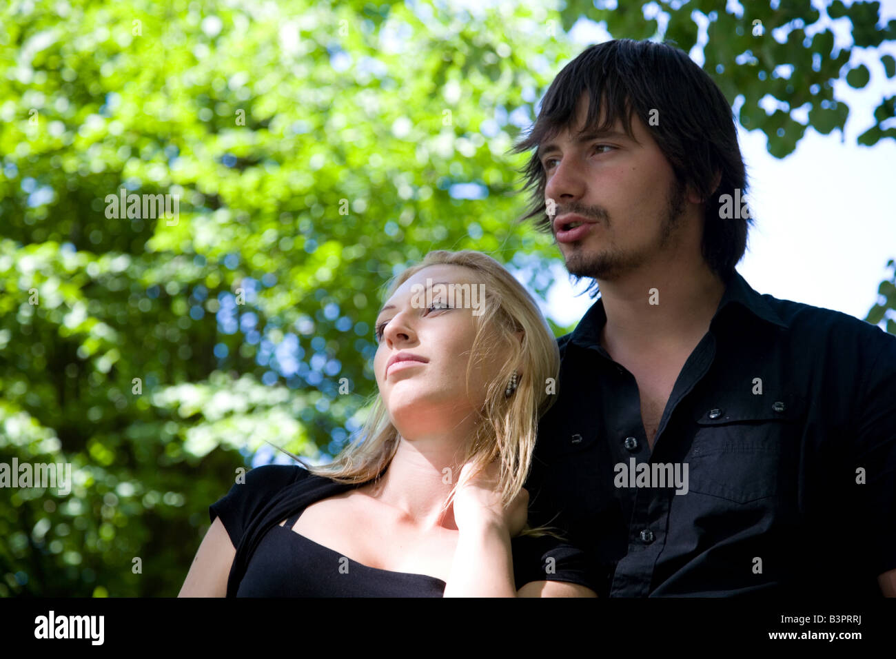 Portrait of the beautiful young people on nature Stock Photo - Alamy
