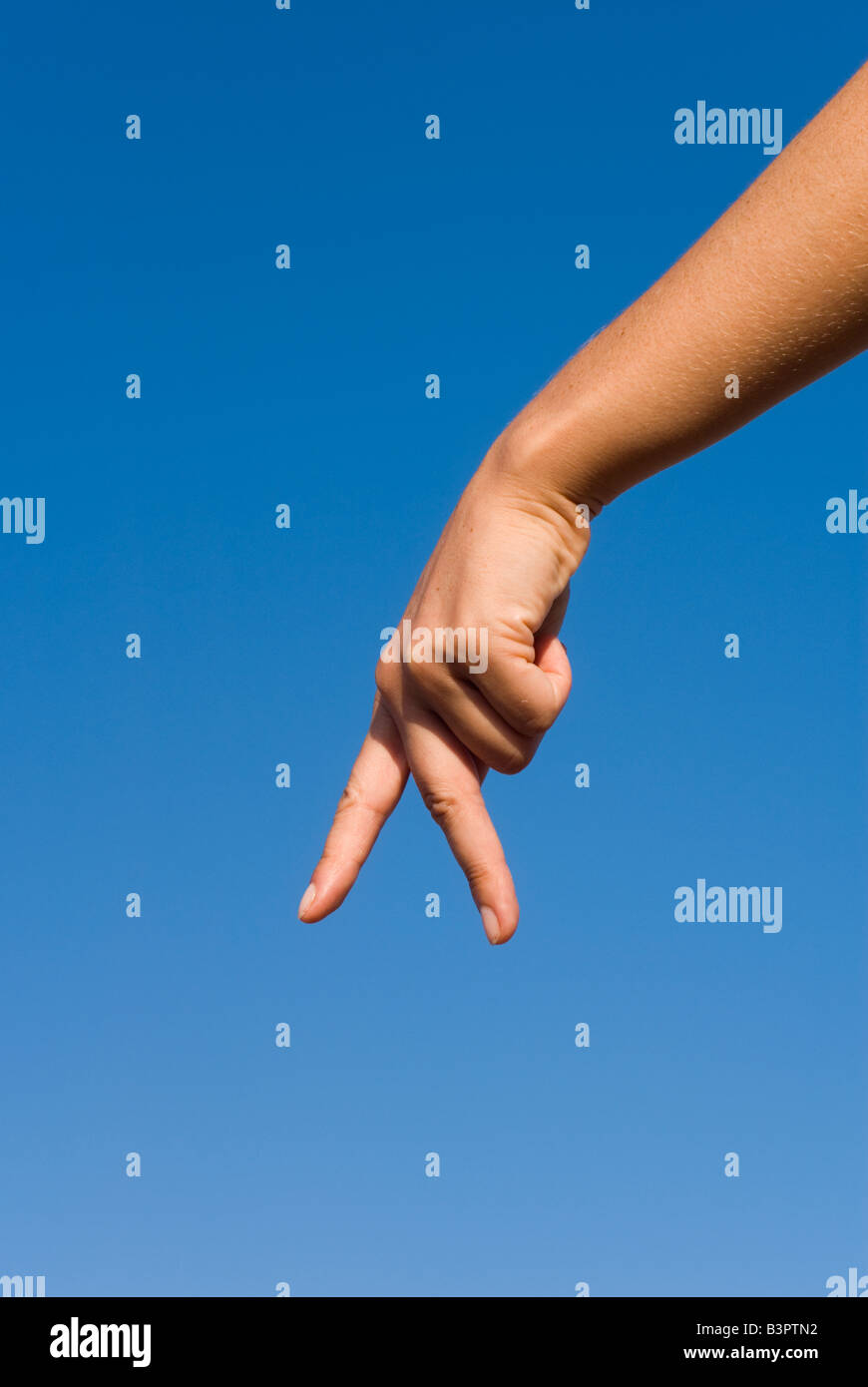 Model Released Detail of female hand forming a walking sign Stock Photo ...