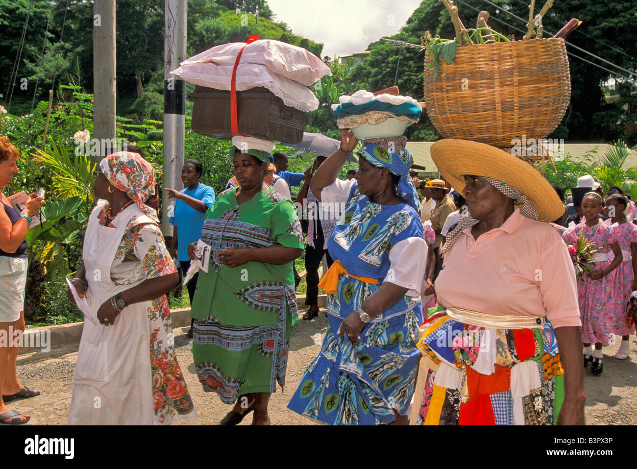 Caribbean women wearing baskets and laundry on their heads at the ...