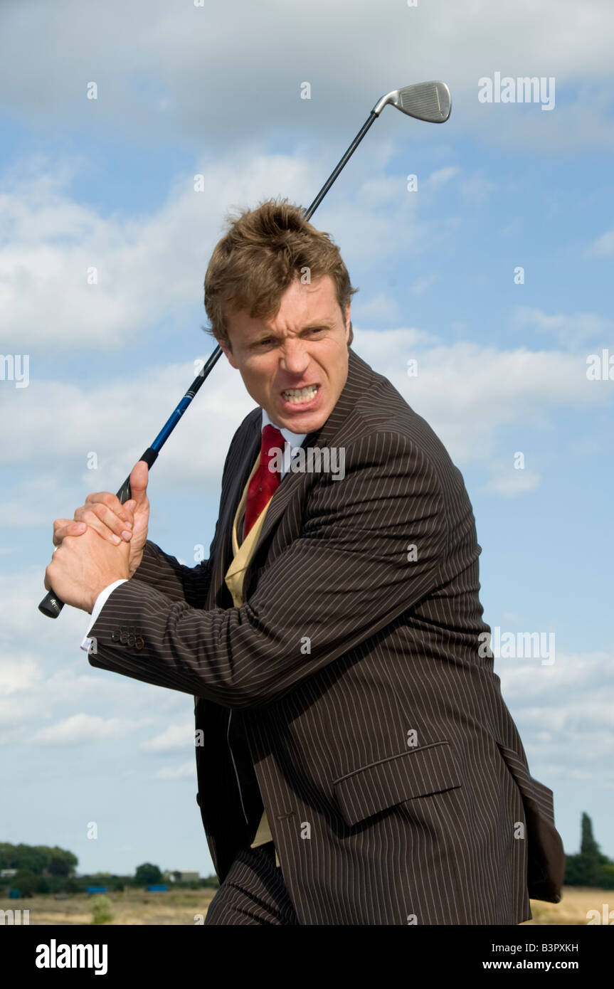 Business man golf club gun hi-res stock photography and images - Alamy