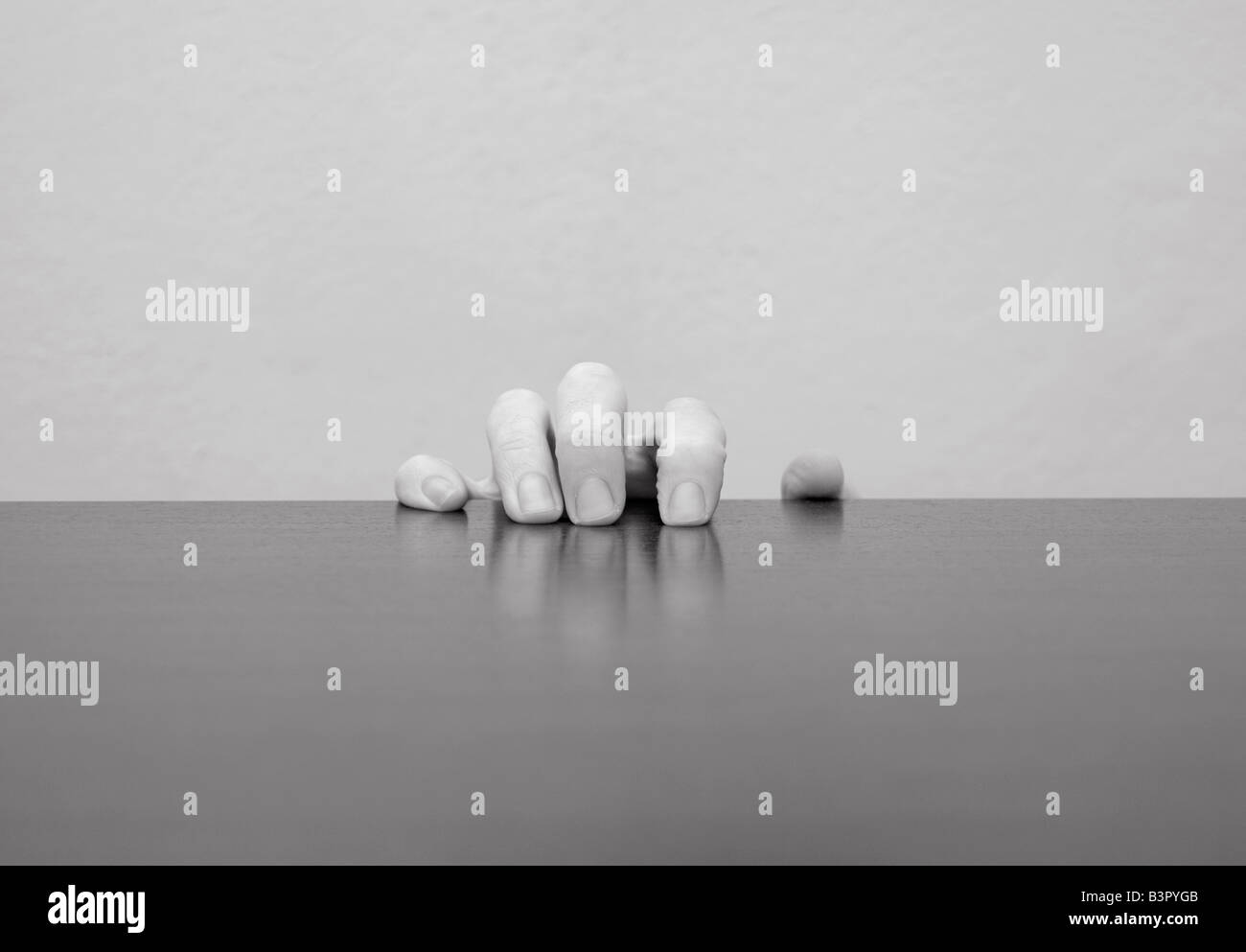 hand grasping table Stock Photo - Alamy
