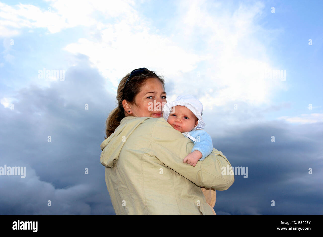 Old woman hugging baby hi-res stock photography and images - Alamy