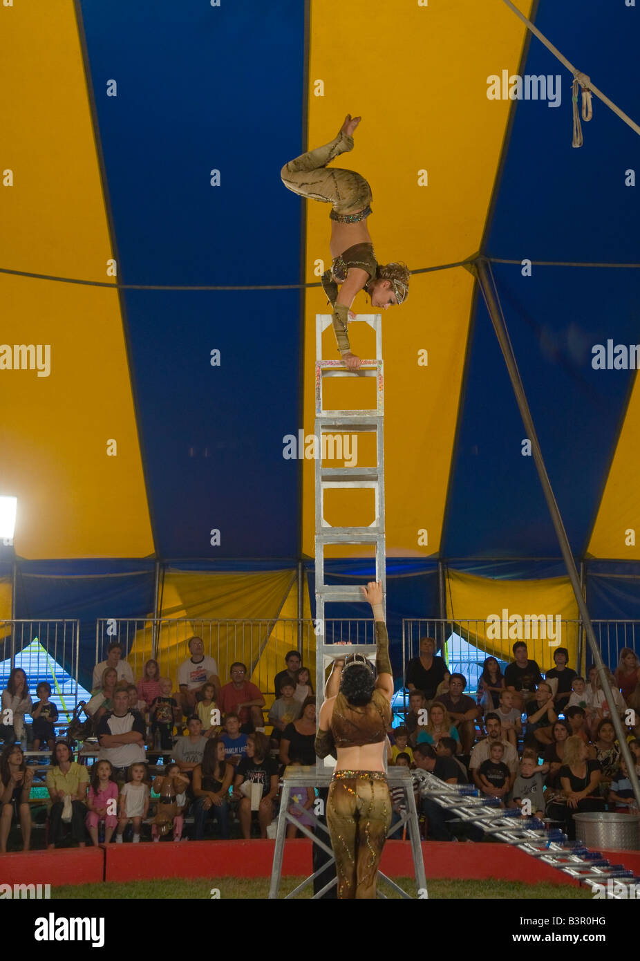 Ladder balance acrobat hi-res stock photography and images - Alamy